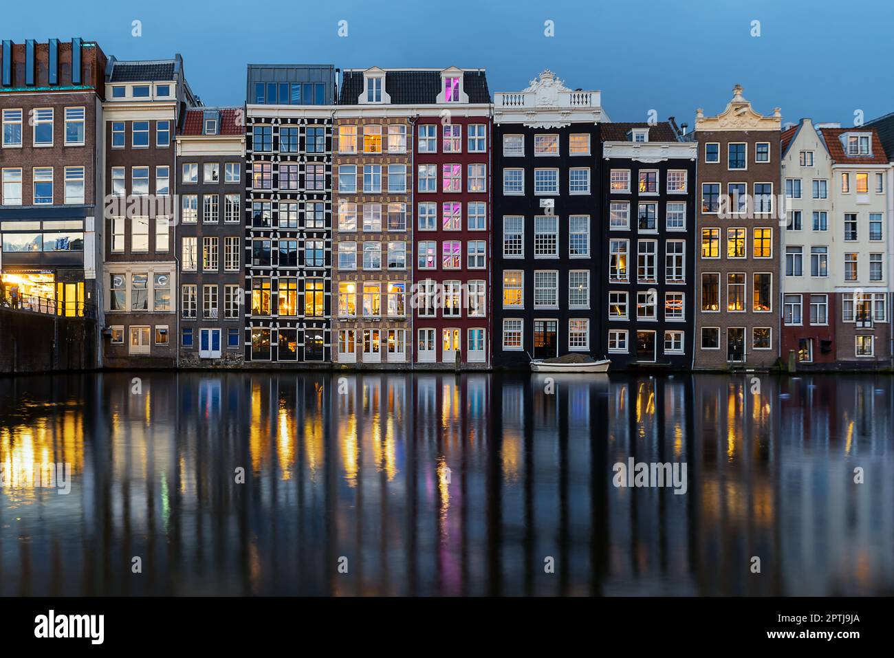 Dancing Houses Damrak Amsterdam during the evening lights Netherlands ...