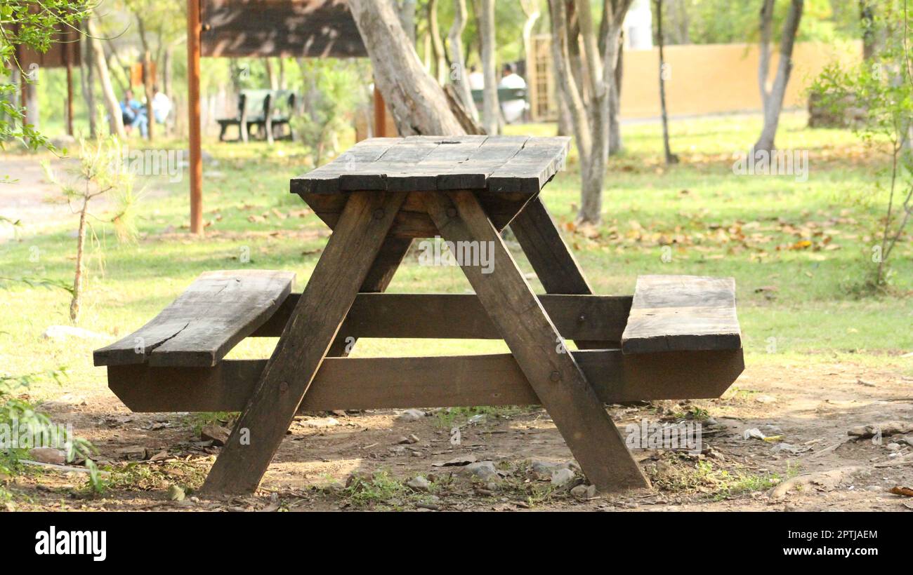 wooden sitting bench in a park Stock Photo - Alamy