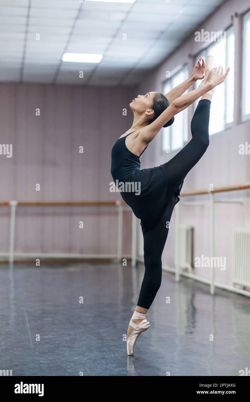 Asian woman dancing in ballet class doing bilman pose Stock Photo - Alamy