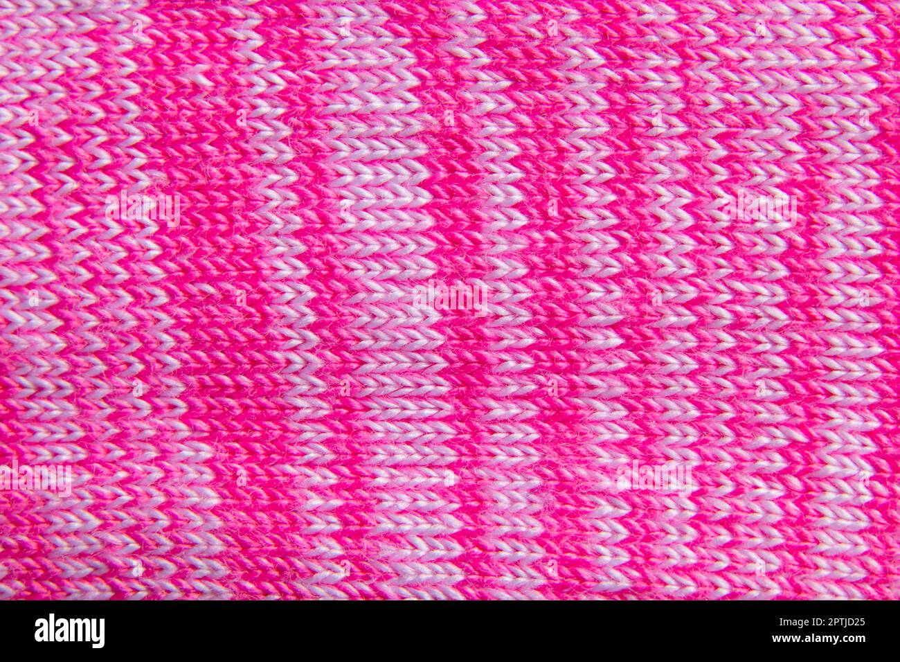 light pink knitted fabric sweaters closeup as background Stock Photo ...