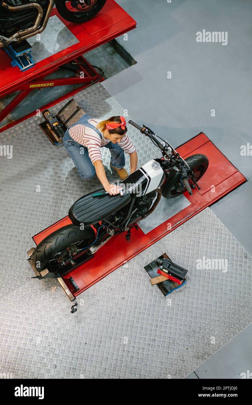 Female mechanic working on vintage hi-res stock photography and images ...
