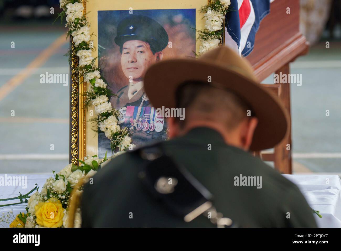 A Gurkha soldier pays his respects in front of the coffin of Rambahadur ...