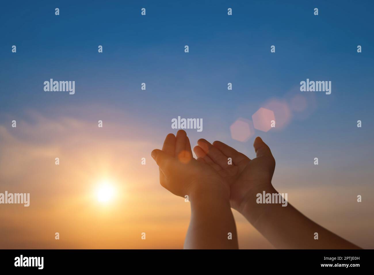 Child open empty hands with palms up for hope on sunset background ...