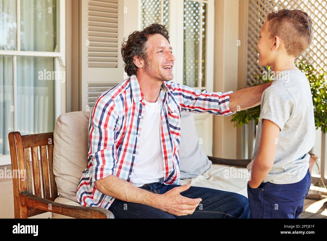 Listening to his father. a father talking to his young son outside ...