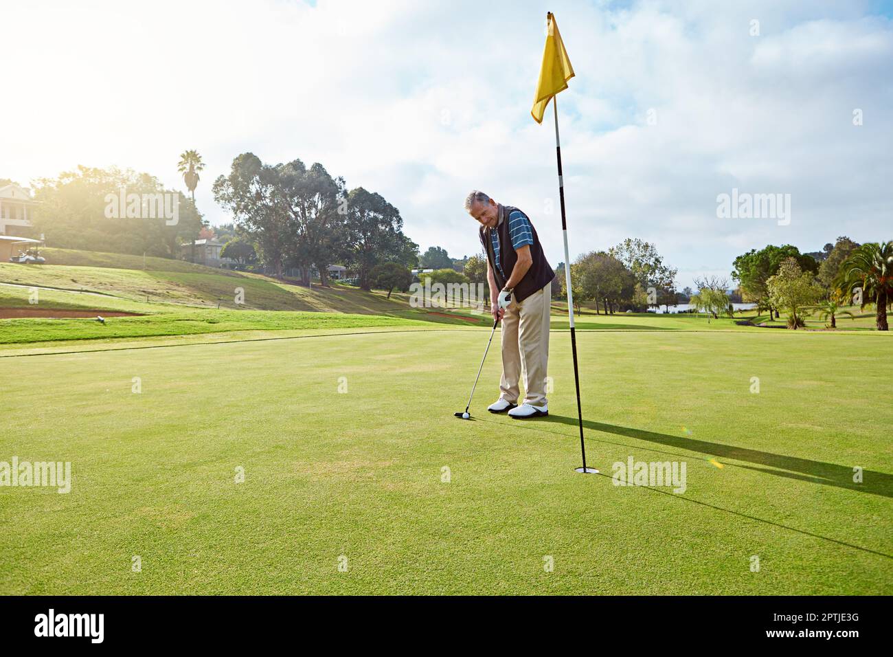 Ending off the front nine. Full length shot of a senior man lining up a ...