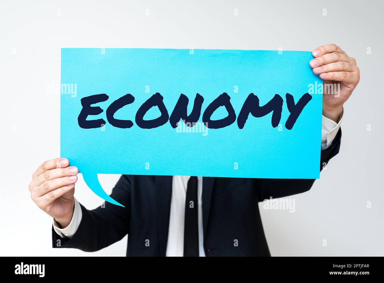 Hand writing sign Economy, Concept meaning the system of how money is ...