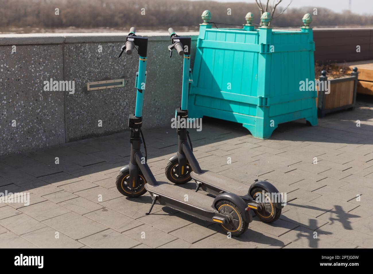 Modern electric scooter parking on the street Stock Photo - Alamy