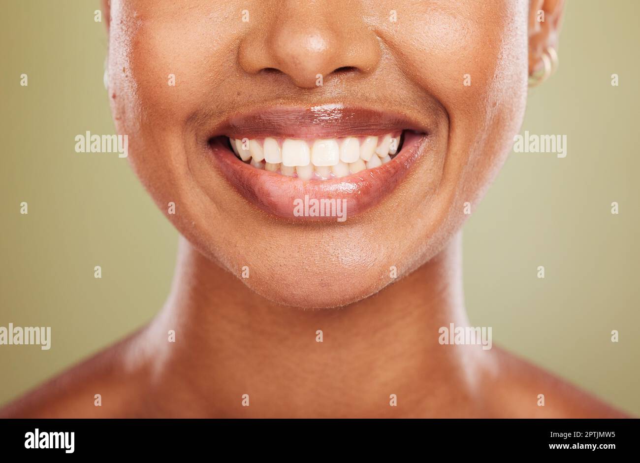 Smile, teeth and mouth of black woman closeup on studio background for ...