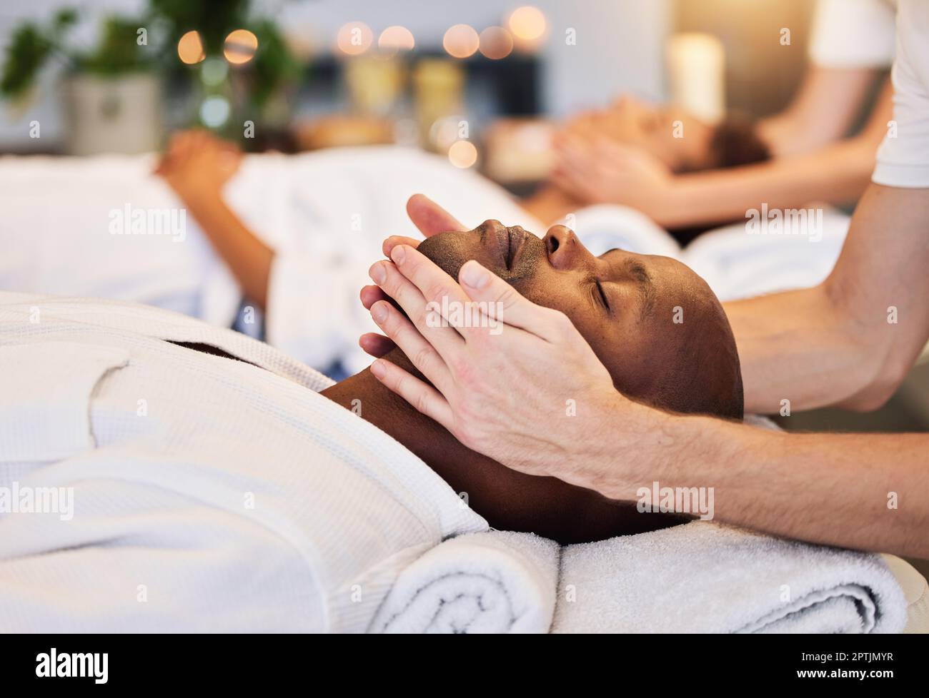 Face massage, beauty therapist and black man, skincare and relax in ...