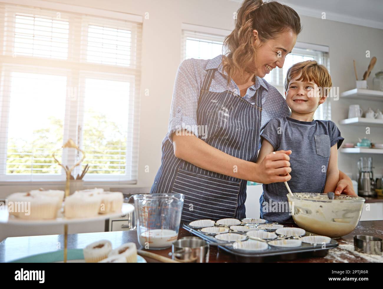 I think we should bake more often mom. a mother and her son baking ...