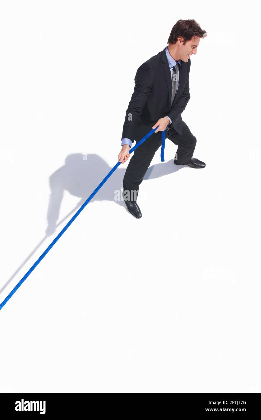 Top view of a business man pulling a rope isolated on white. Top view ...