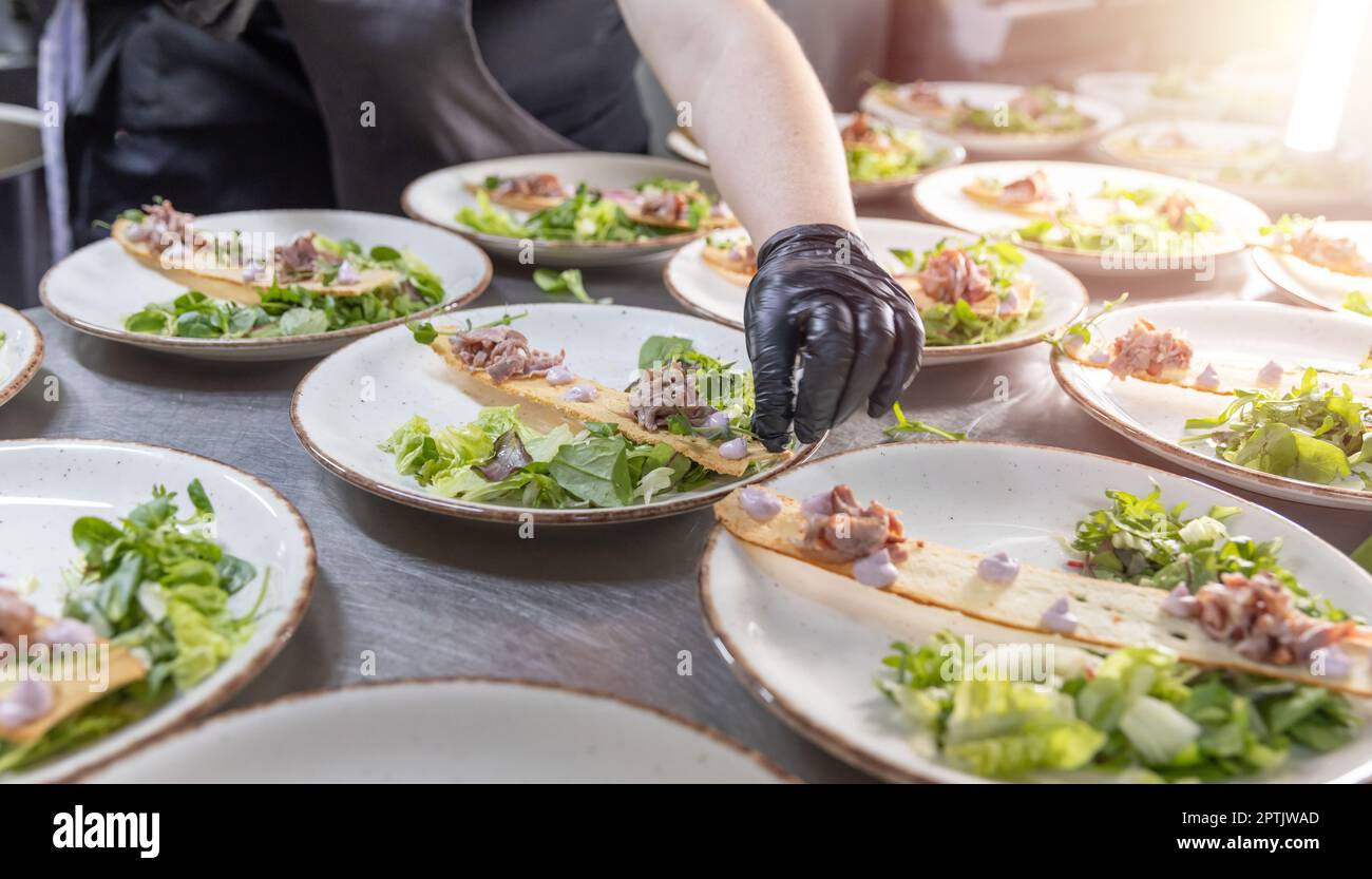 Chef is making final touch to the plate Stock Photo - Alamy