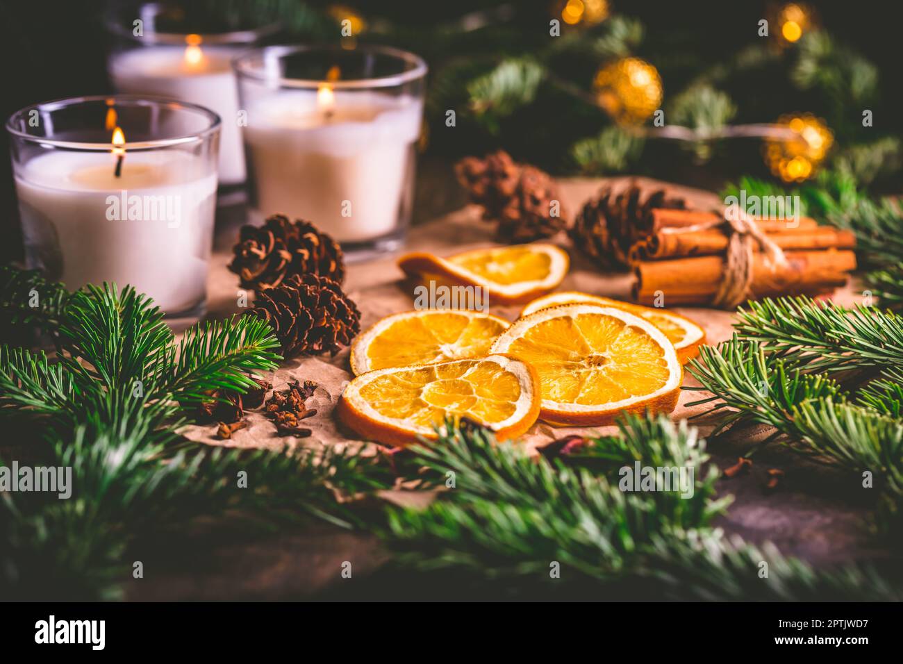 Dried orange and Christmas spices with branches of christmas tree ...