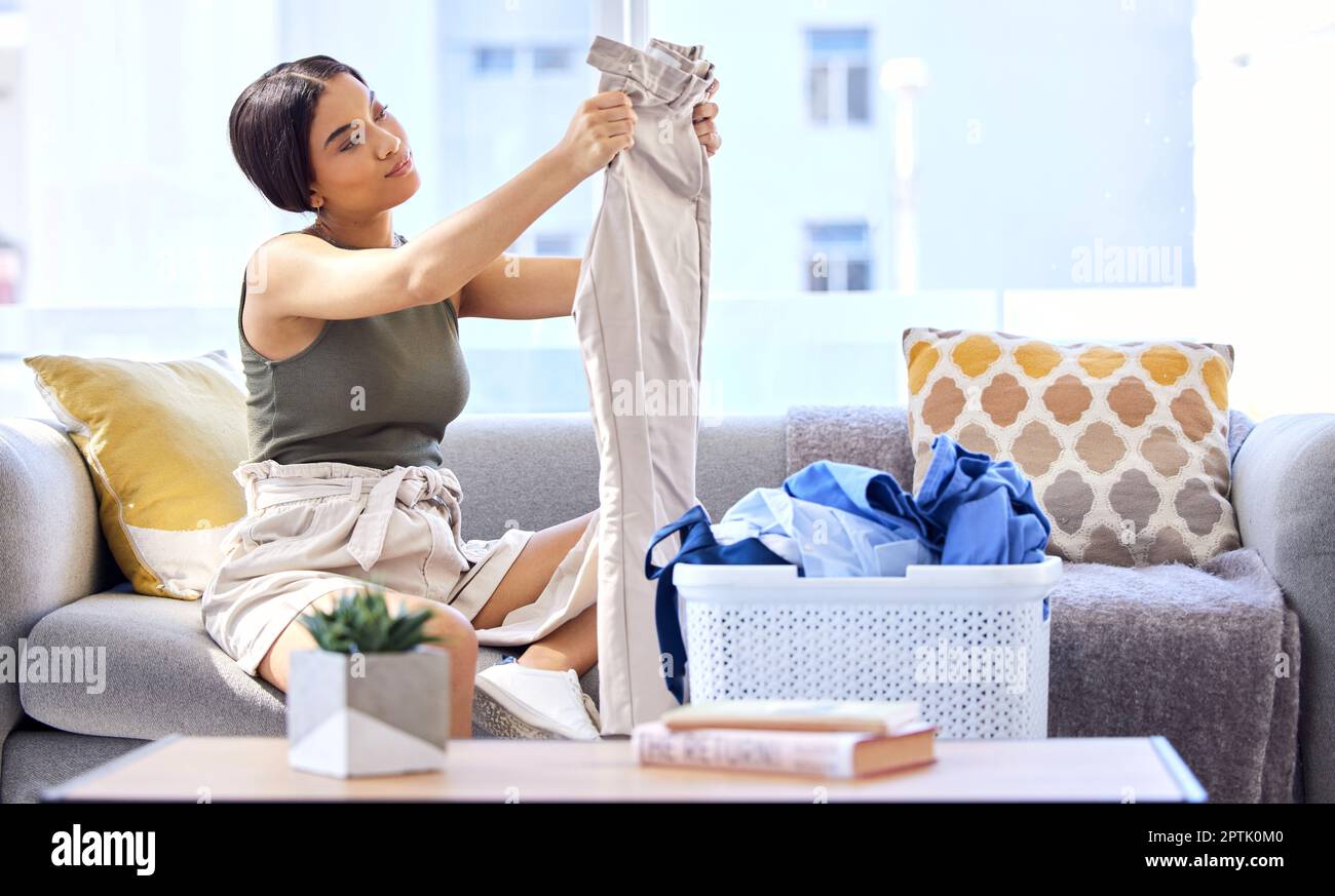 Woman folding clean clothes hi-res stock photography and images - Alamy
