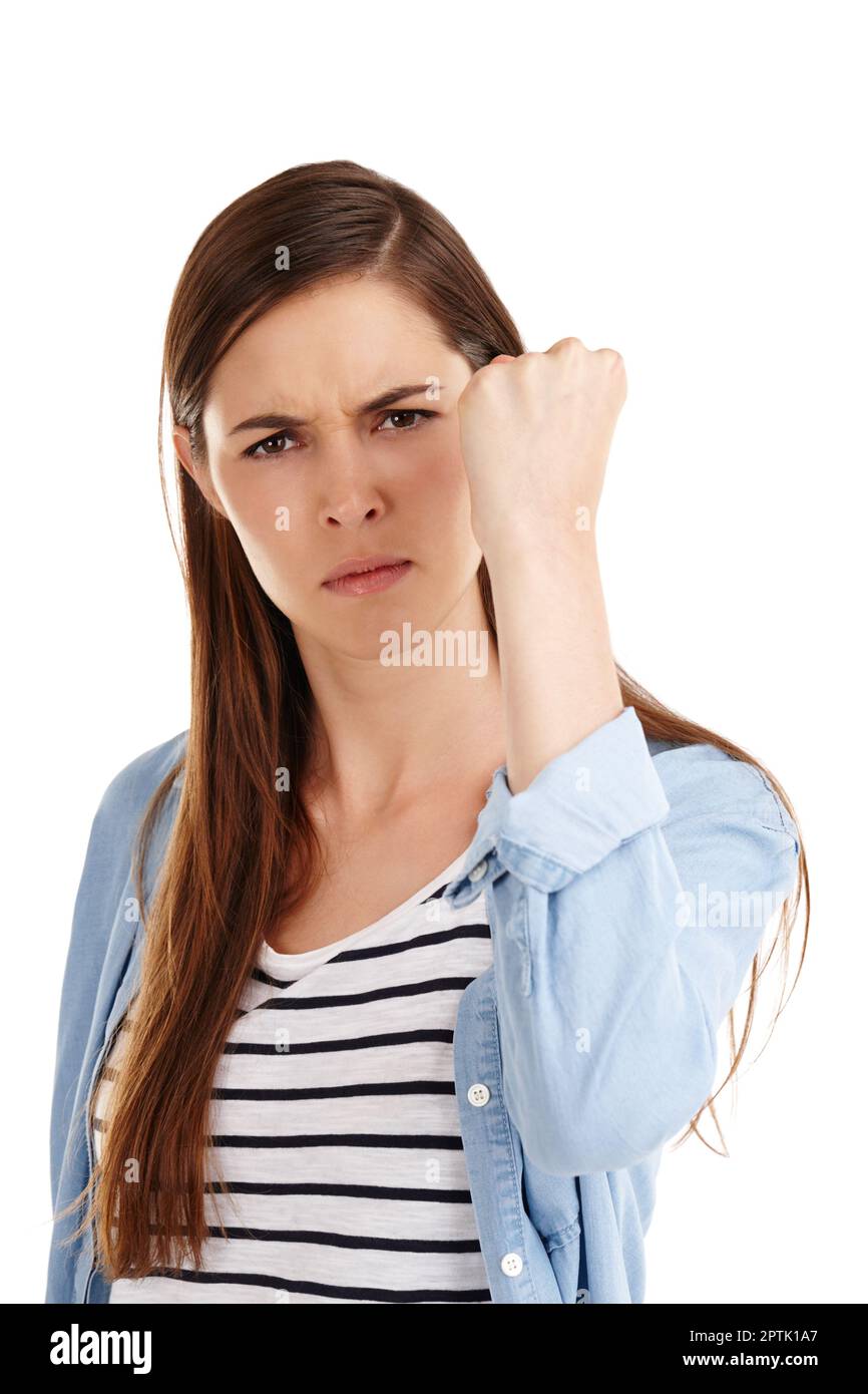 Why I oughtta...Studio shot of a beautiful young woman showing you a ...
