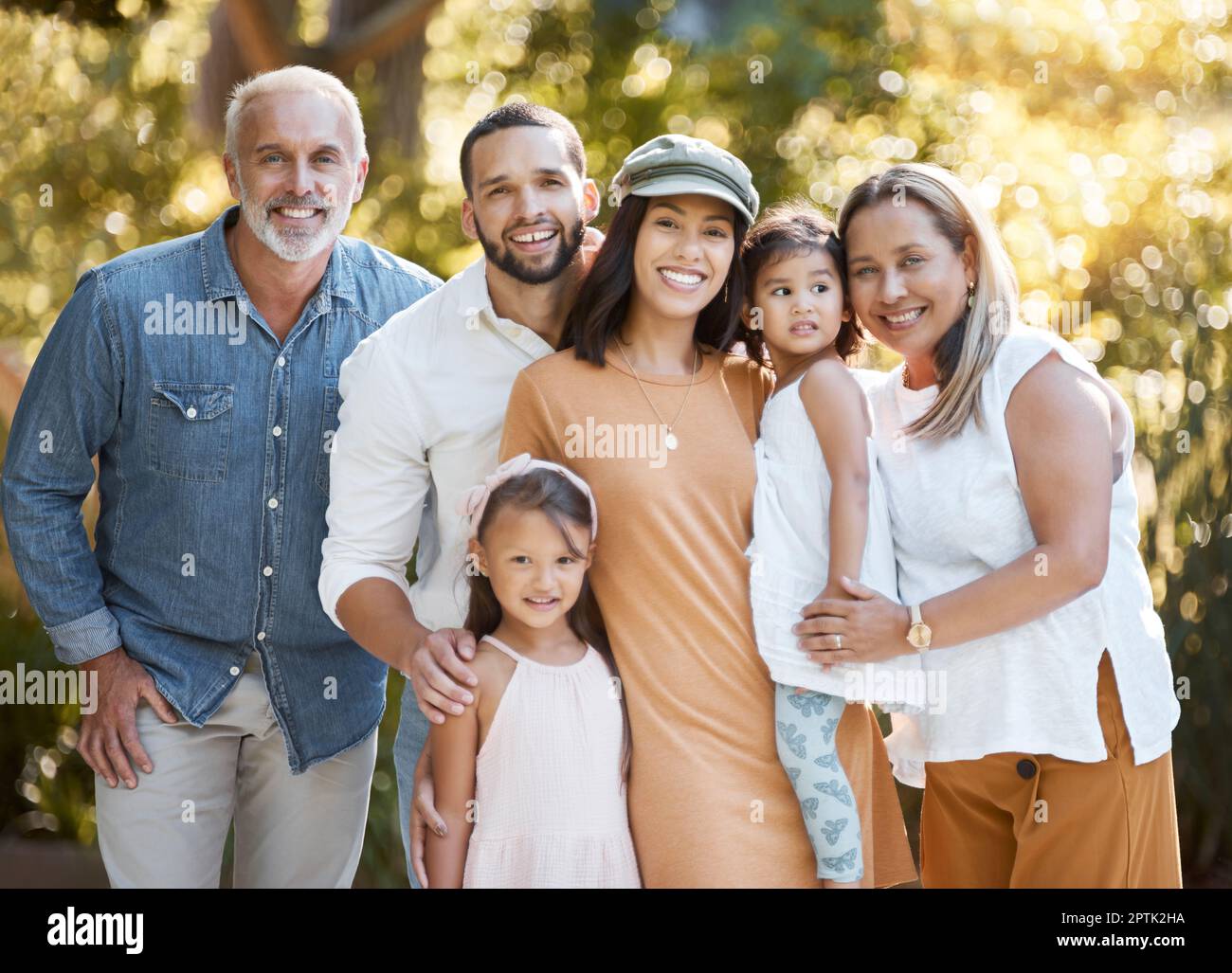 Big family, portrait and happy smile, love and support together outdoor ...