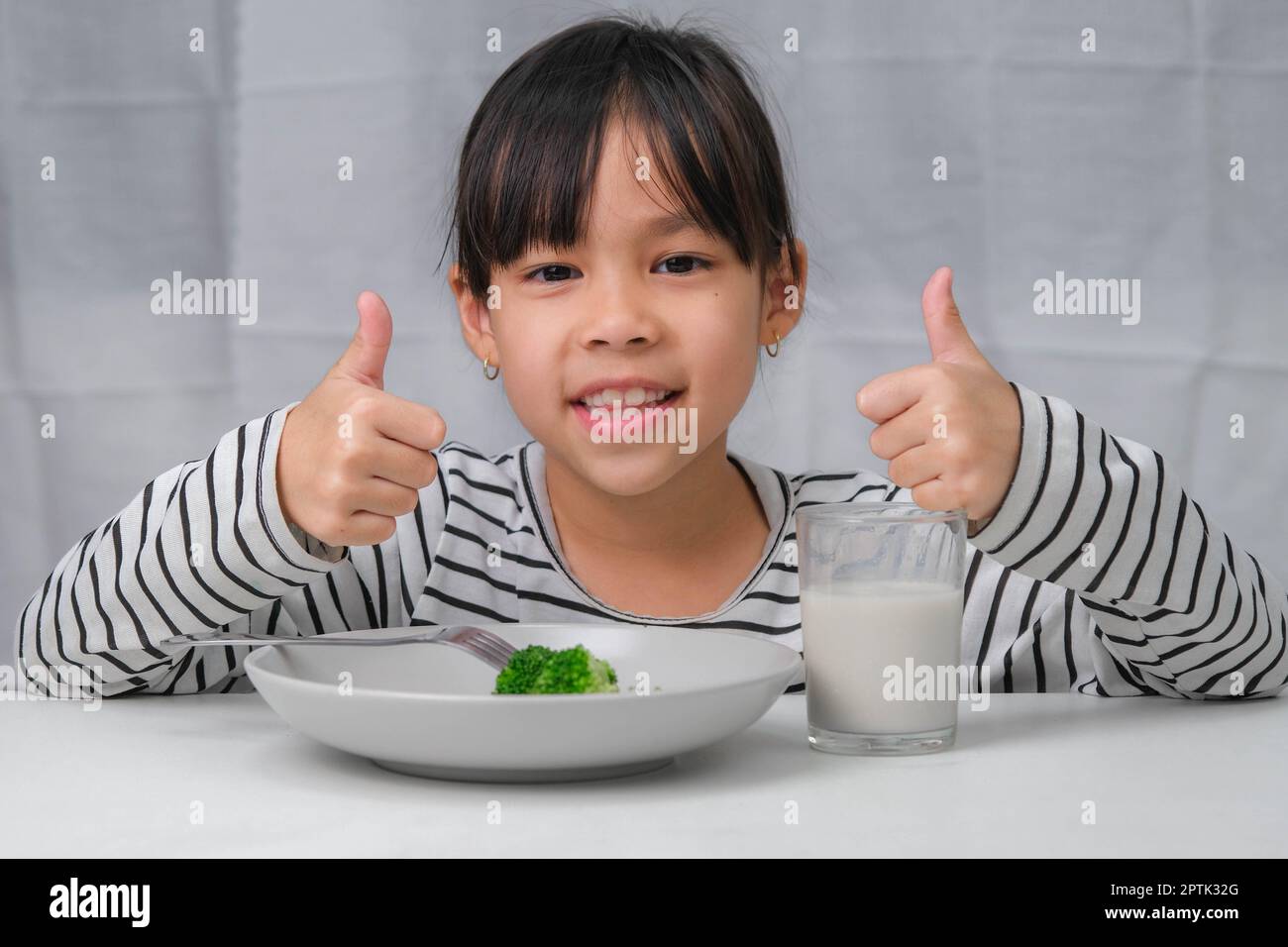Cute Asian Girl Drinking A Glass Of Milk In The Morning Before Going To 3349