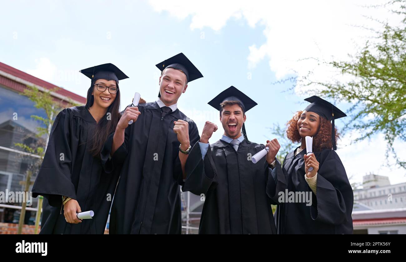 We did it. Low angle shot of university students on graduation day ...