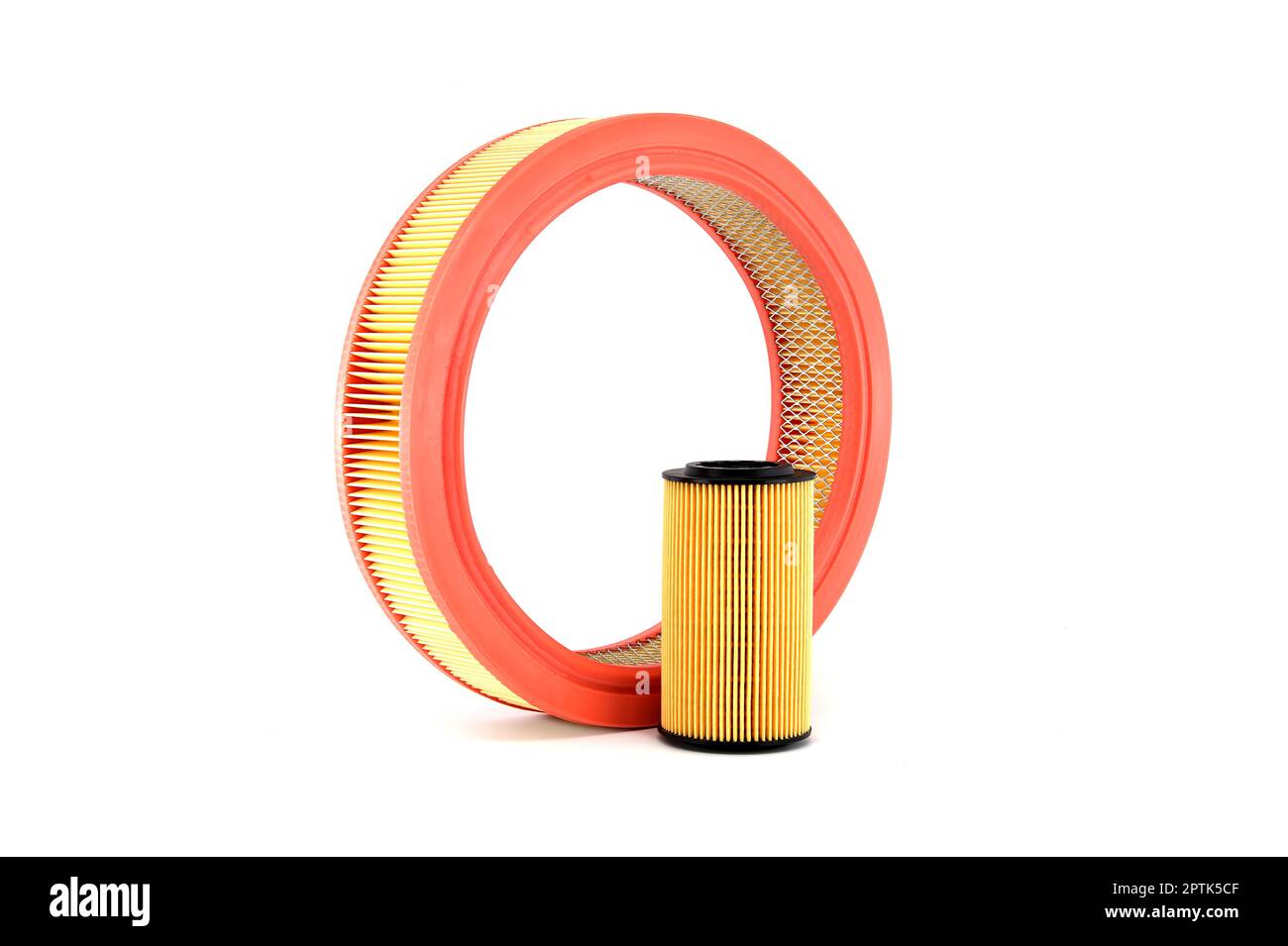 Vehicle engine round air filter and oil filter isolated on a white ...