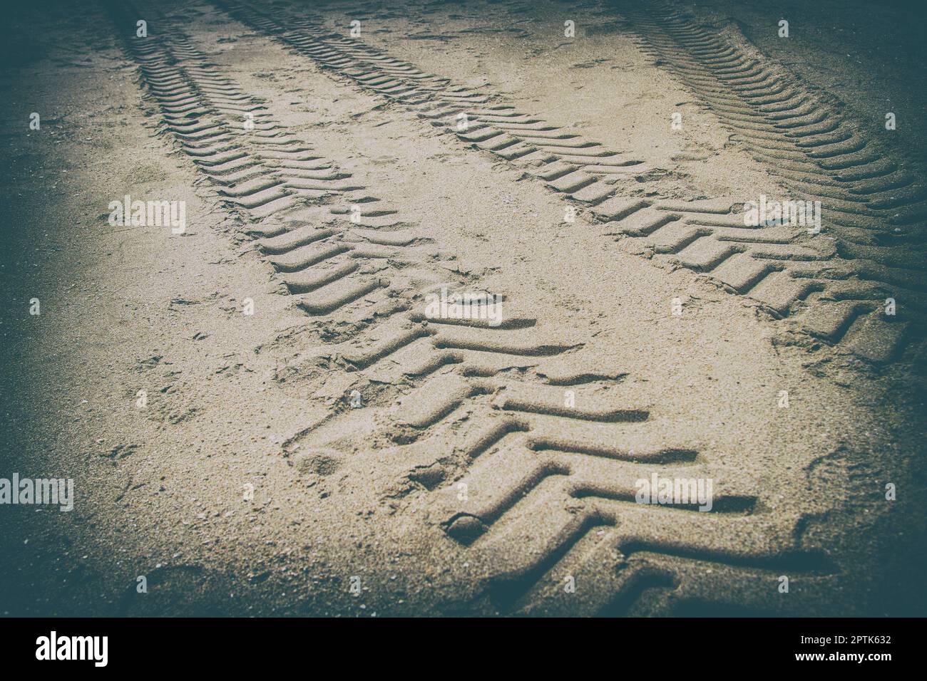 Car marks on the beach in black border Stock Photo - Alamy