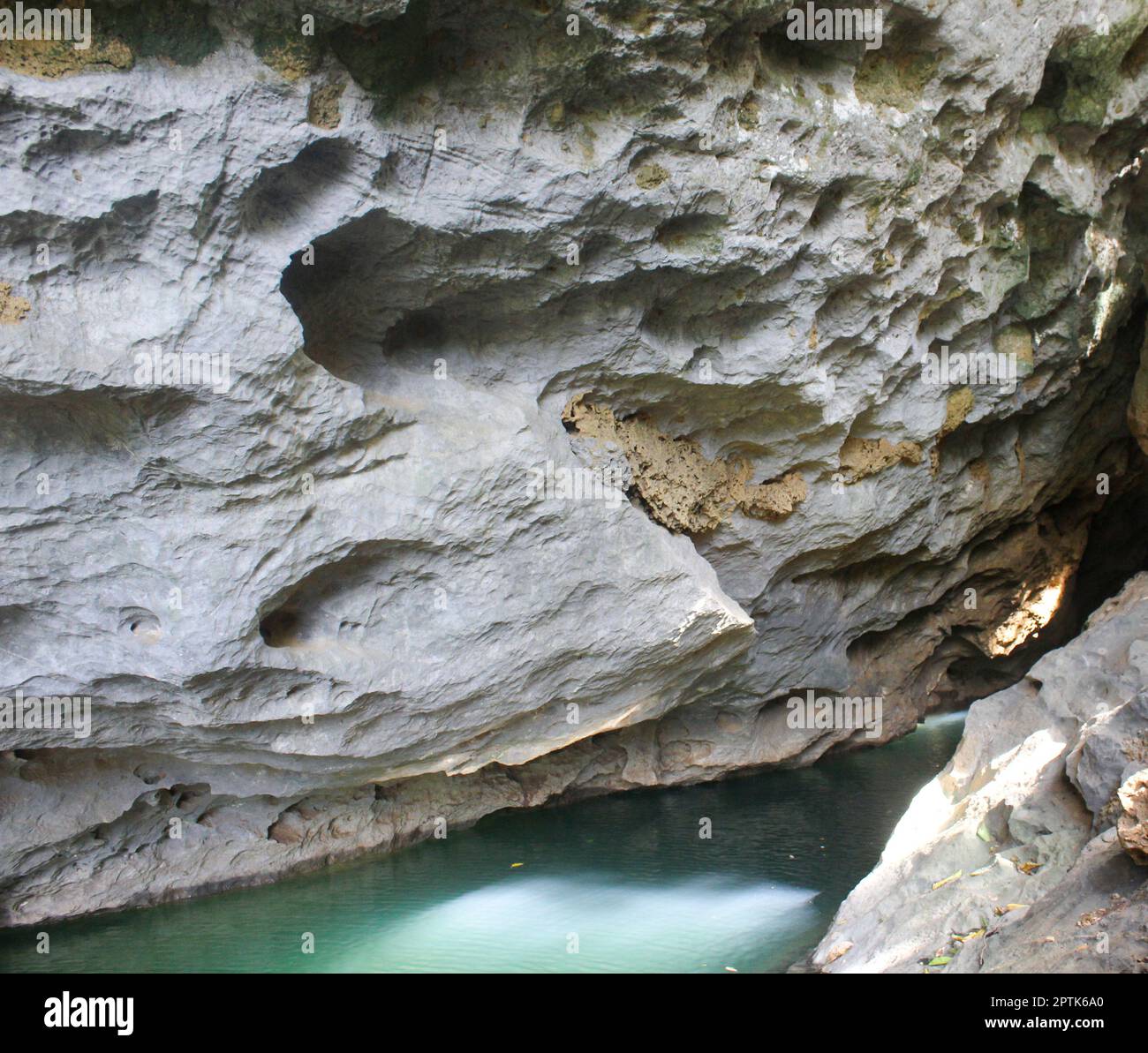 Stone Cavern and Green River in Pucok Krueng Stock Photo - Alamy