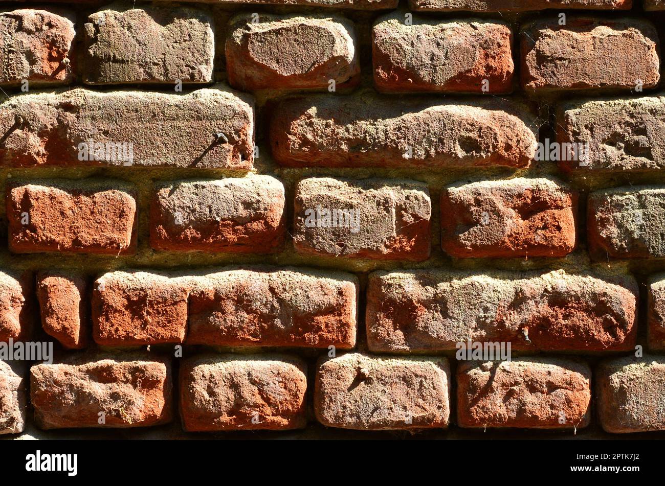 Horizontal wall texture of several rows of very old brickwork made of ...