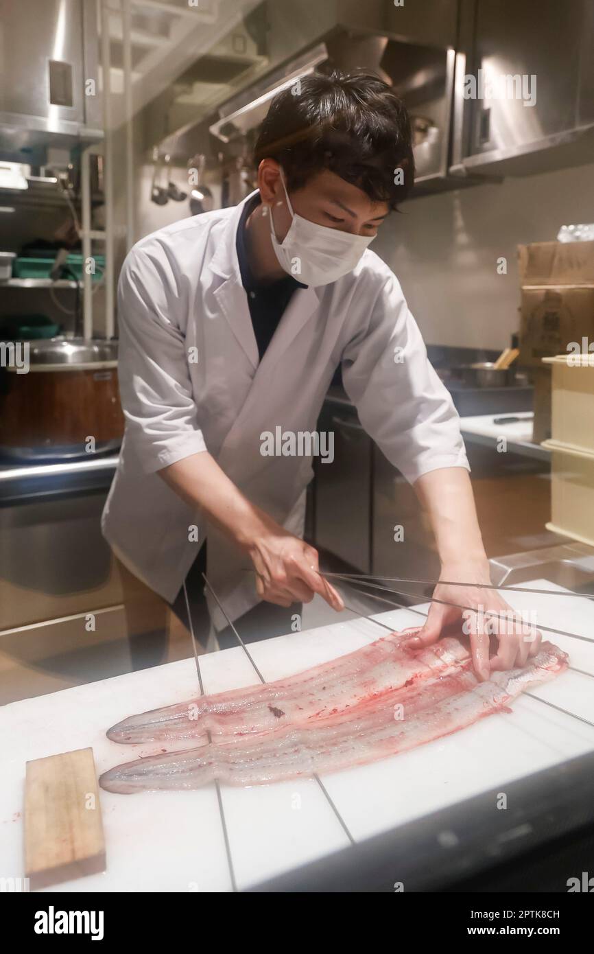 April 26, 2023, Tokyo, Japan: A staff member prepares Unagi or ...