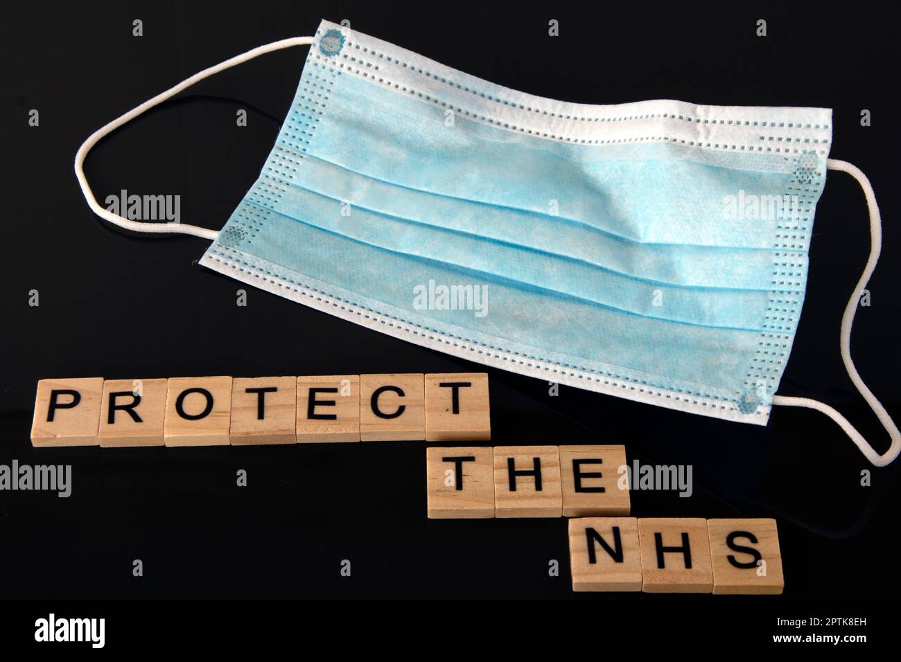 Coronavirus pandemic, mask with PROTECT THE NHS in words Stock Photo ...
