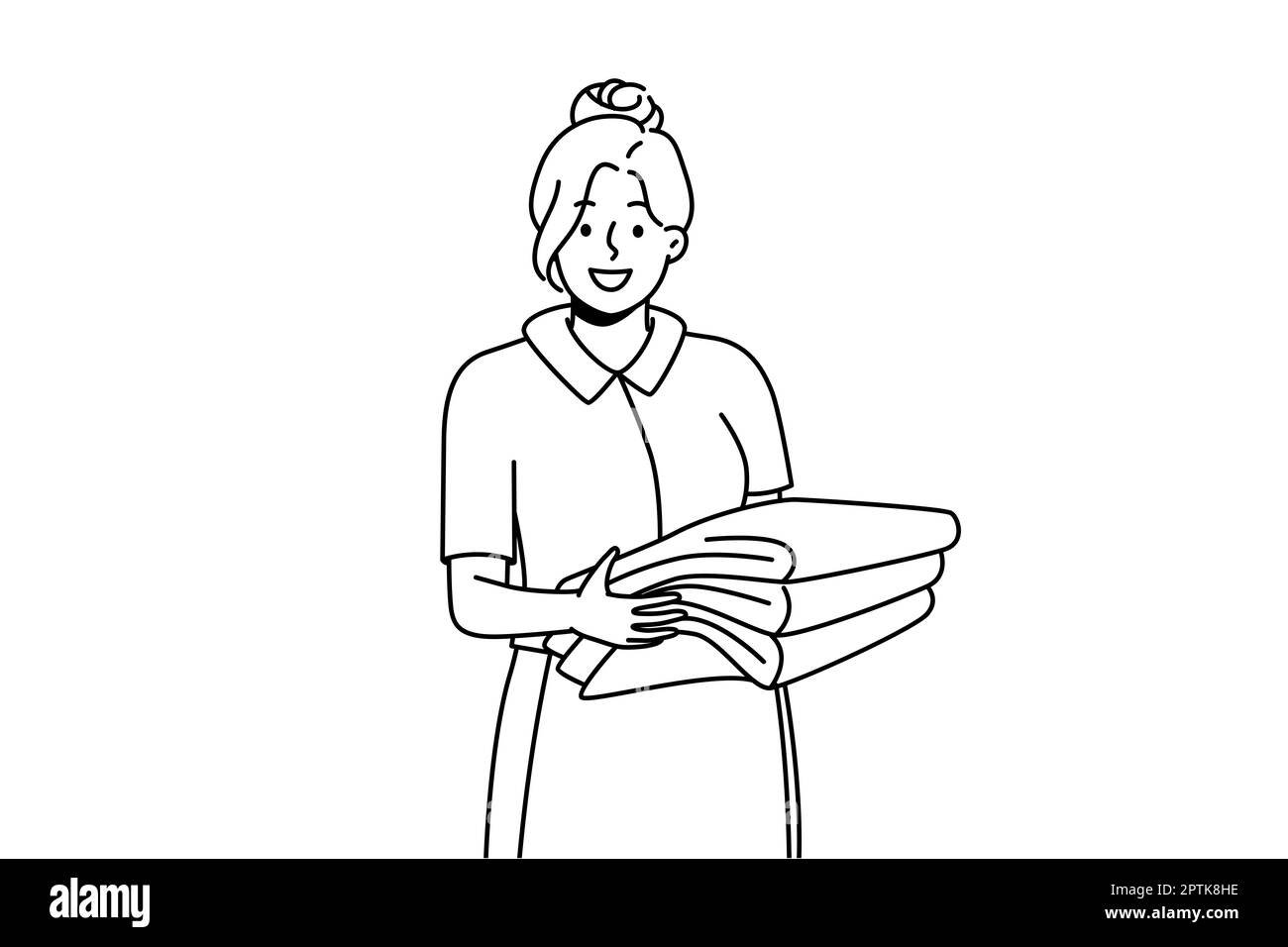 Smiling housekeeper in uniform holding stack of towels. Happy female ...