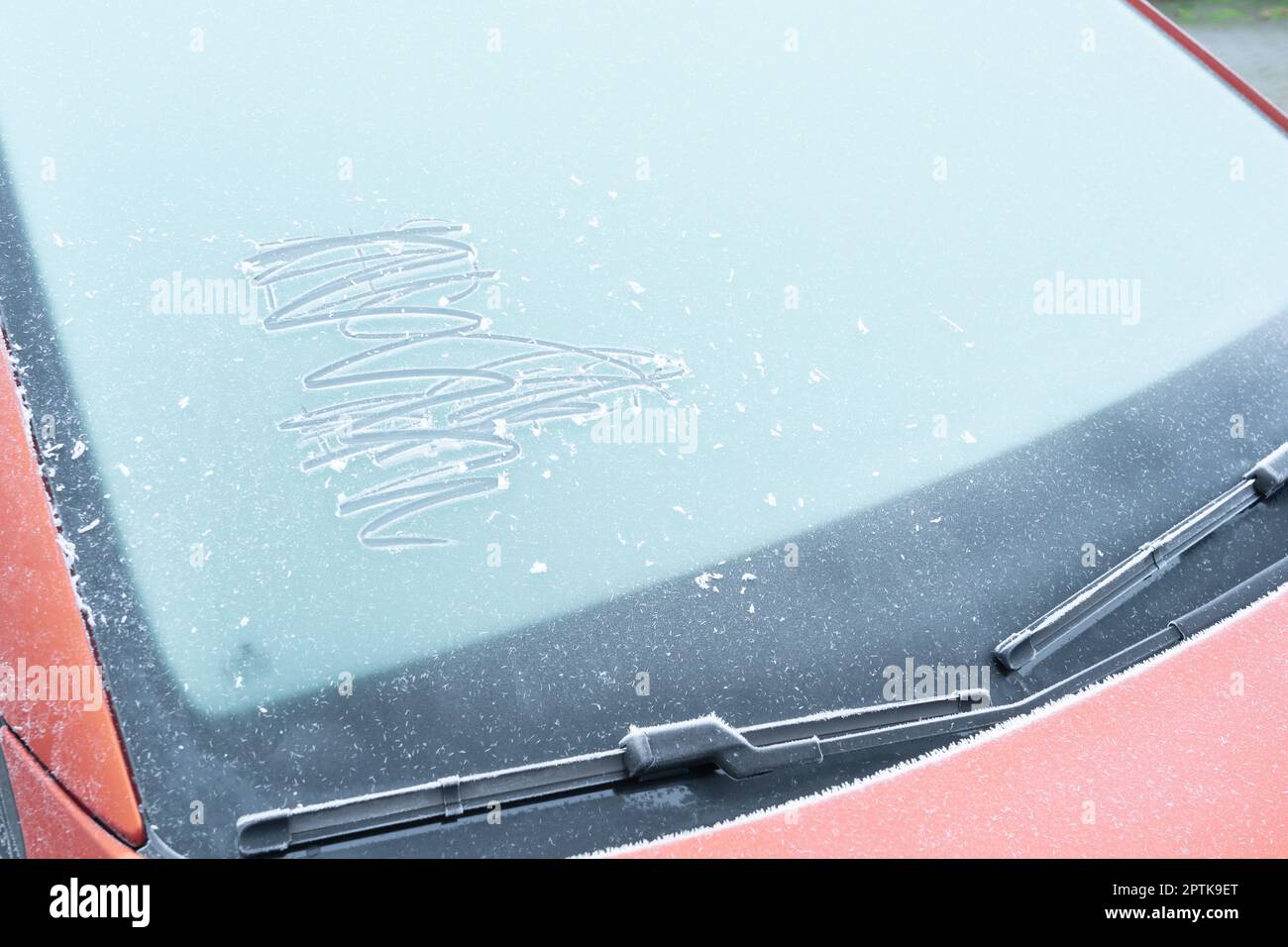 Red car with a frozen window Stock Photo - Alamy