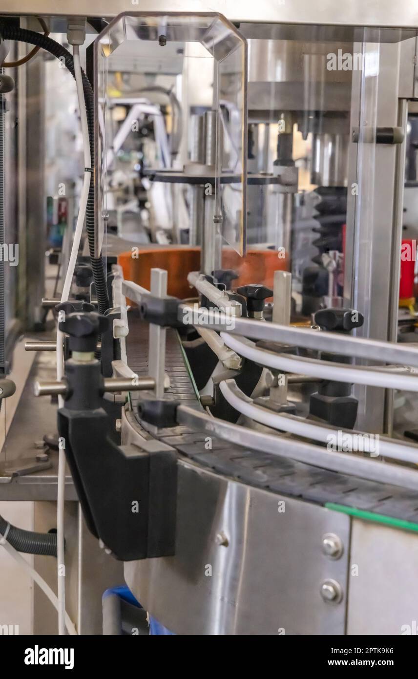 Industrial bottling machine at modern wine factory in Italy, close up ...