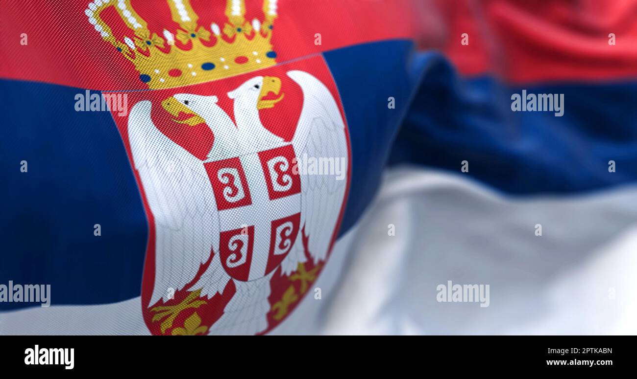 Close-up view of the Serbia national flag waving in the wind. The ...