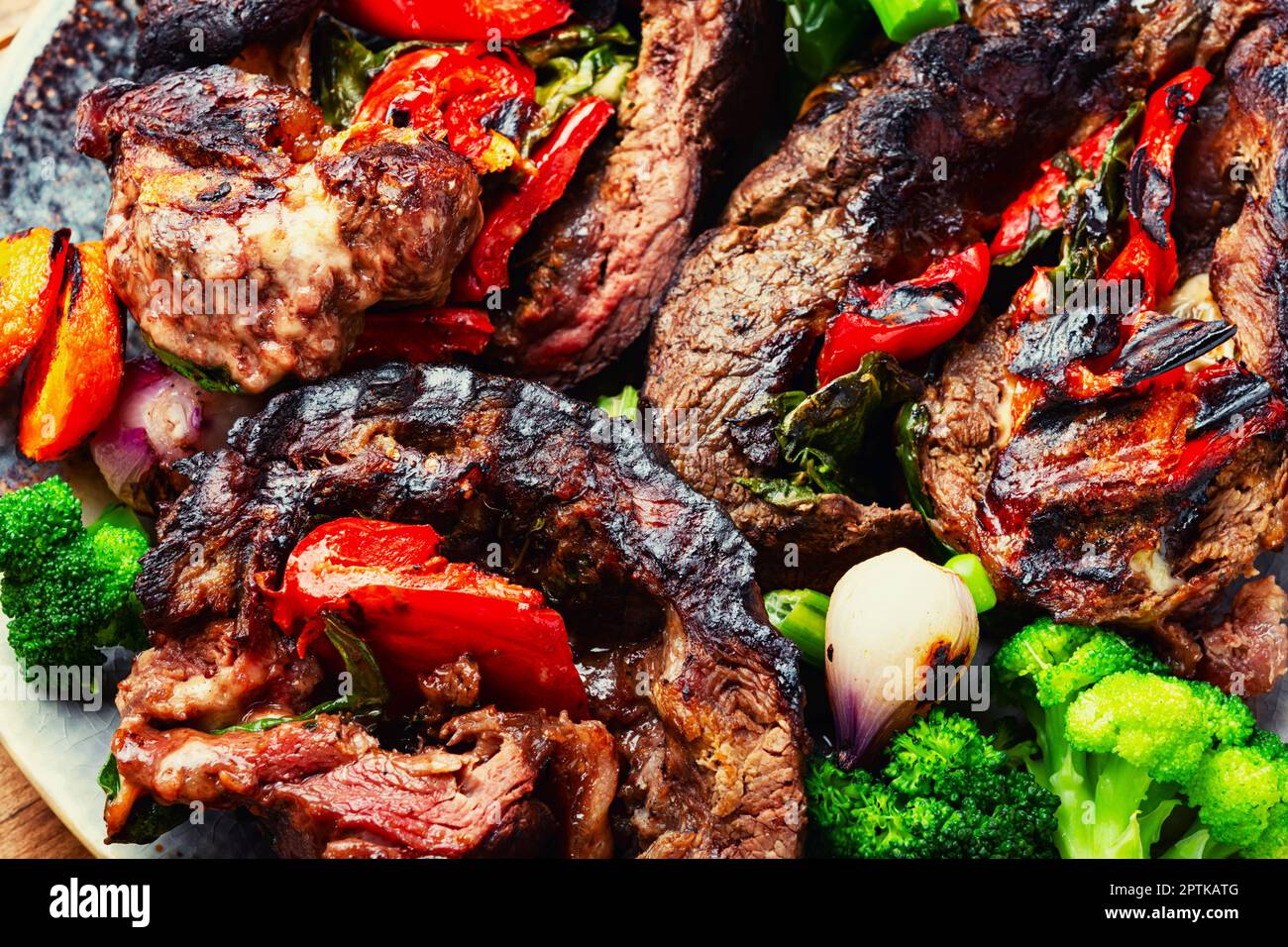 Smoked fried meat with vegetable garnish. Meat rolls,food background ...