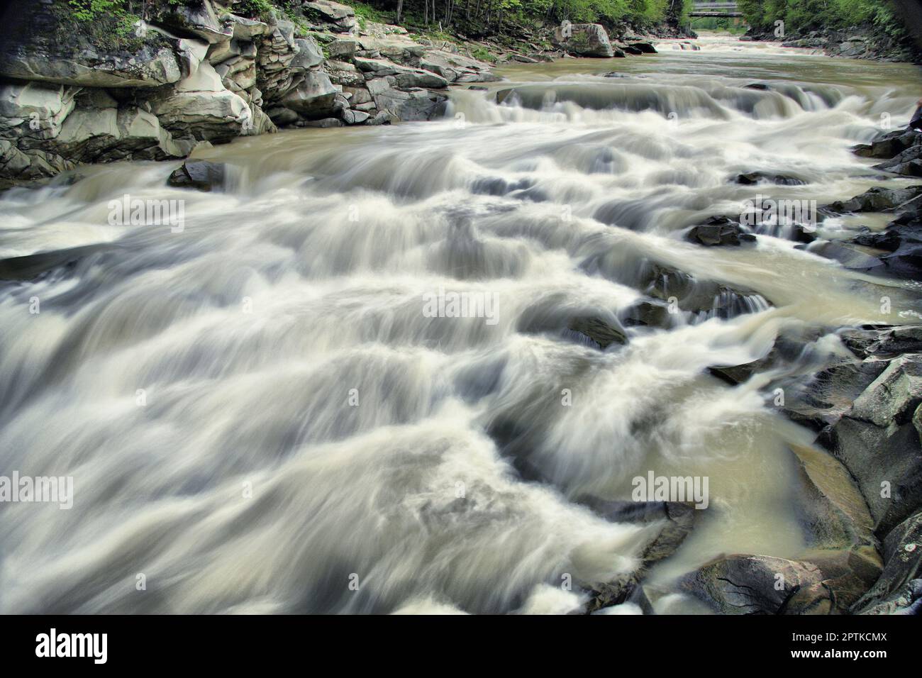 Small stream flows over stones hi-res stock photography and images - Alamy