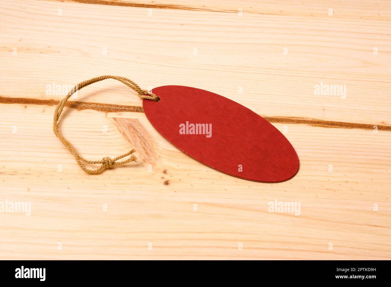 A red paper label with ribbon Stock Photo - Alamy