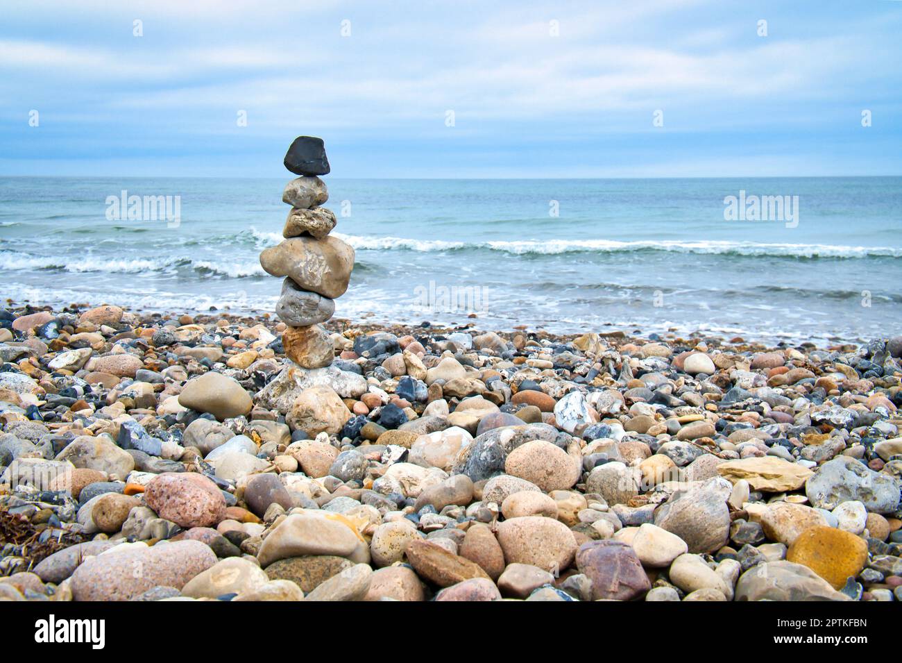 Stone pyramid on the beach overlooking the sea. Danish coast ...