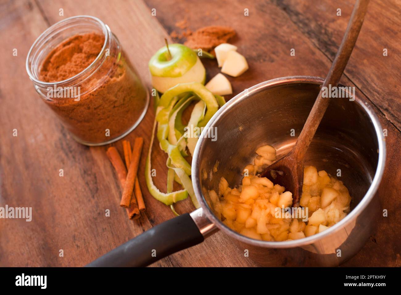 Brown sugar, cinnamon sticks, peeled green apple and ingredients for a ...