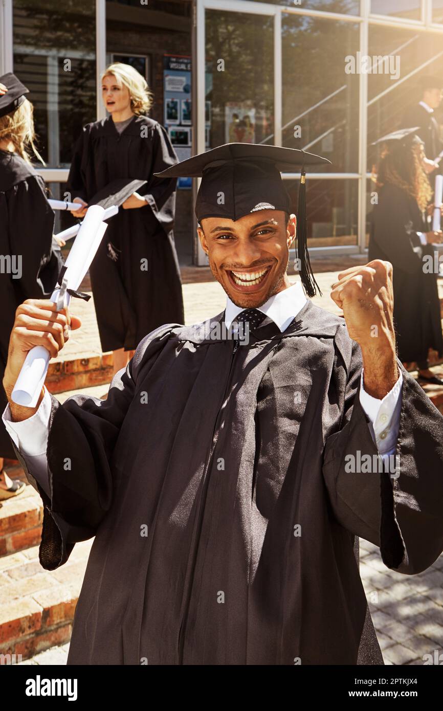 Heck ya I did graduated. Portrait of a smiling university student ...
