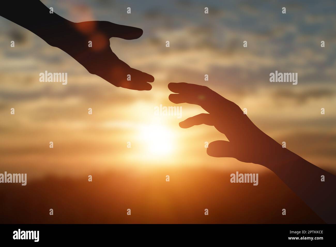 Silhouette Of Reaching Giving A Helping Hand Hope And Support Each Other Over Sunset