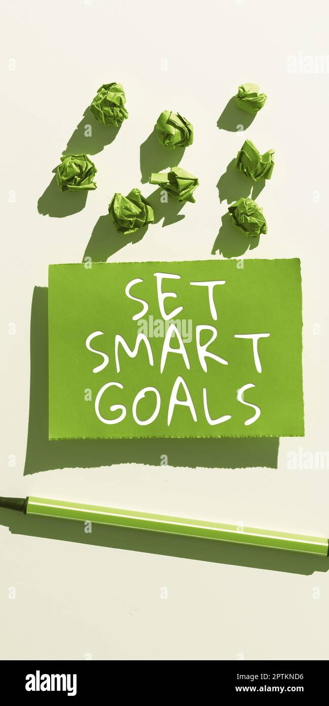 Hand writing sign Set Smart Goals, Concept meaning Establish achievable ...