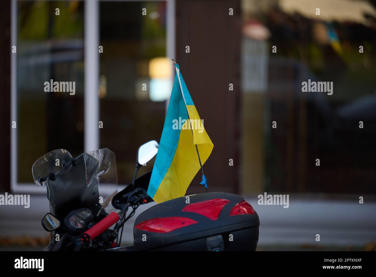 Ukrainian yellow-blue flag is attached on a motorcycle, november 2022 ...