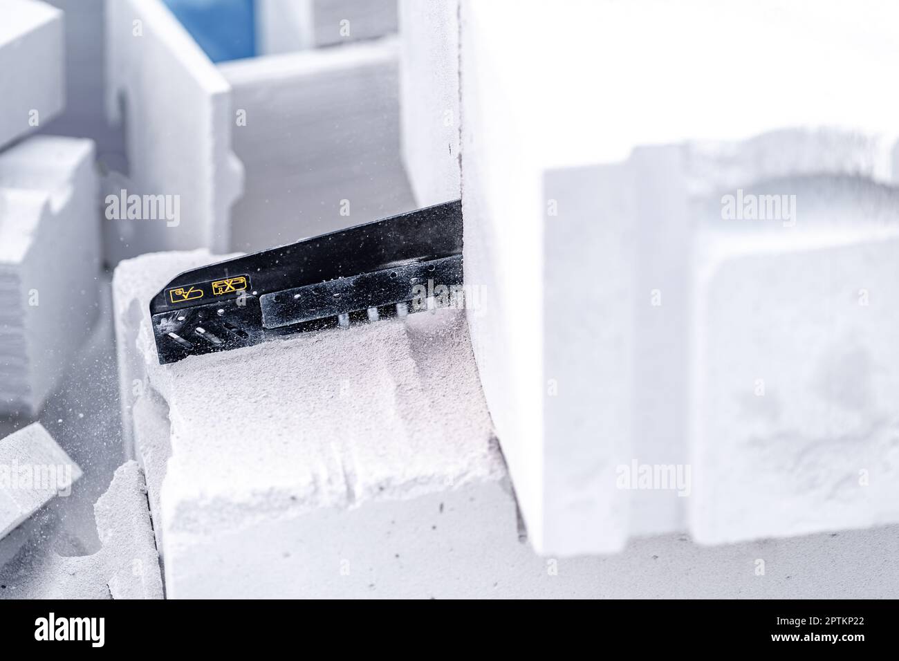cutting concrete blocks with a saw during the construction of a ...