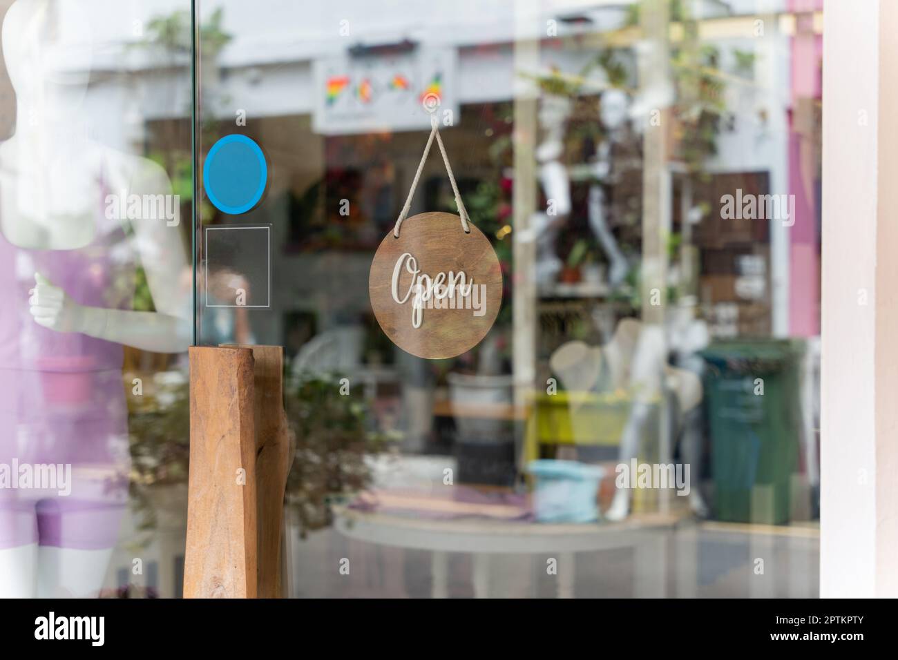 A business sign that says ‘Open’ on local businesses hang on door at ...
