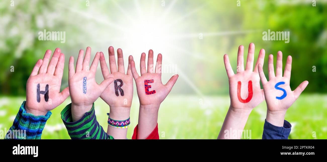 Children Hands Building Word Hire Us, Grass Meadow Stock Photo - Alamy