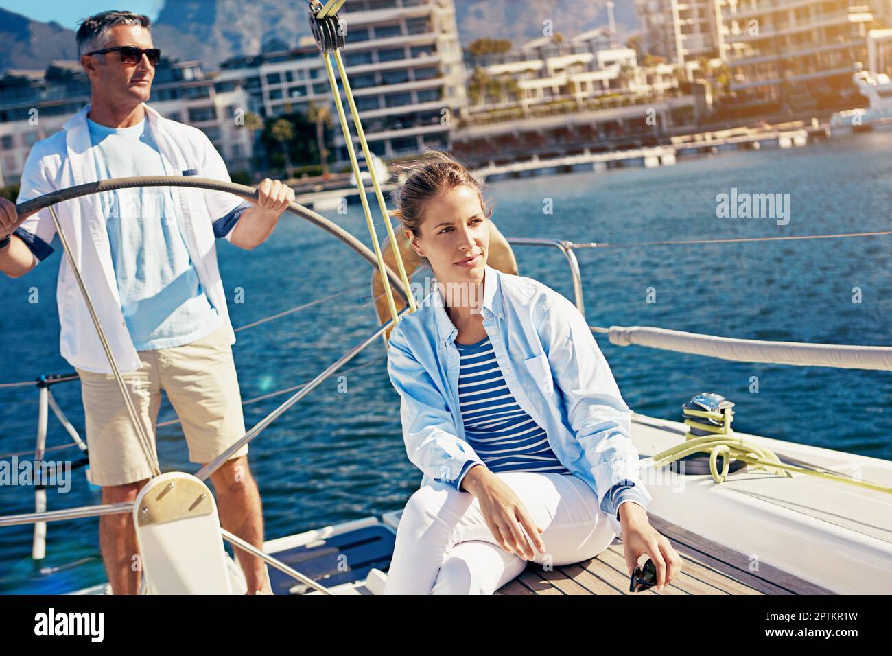 Working on their bucket list. a couple out sailing on a yacht Stock ...