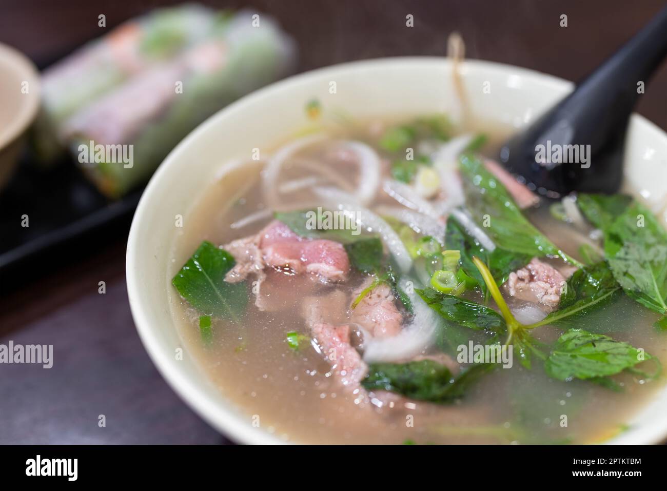 Vietnamese pho rice noodle with raw beef Stock Photo - Alamy