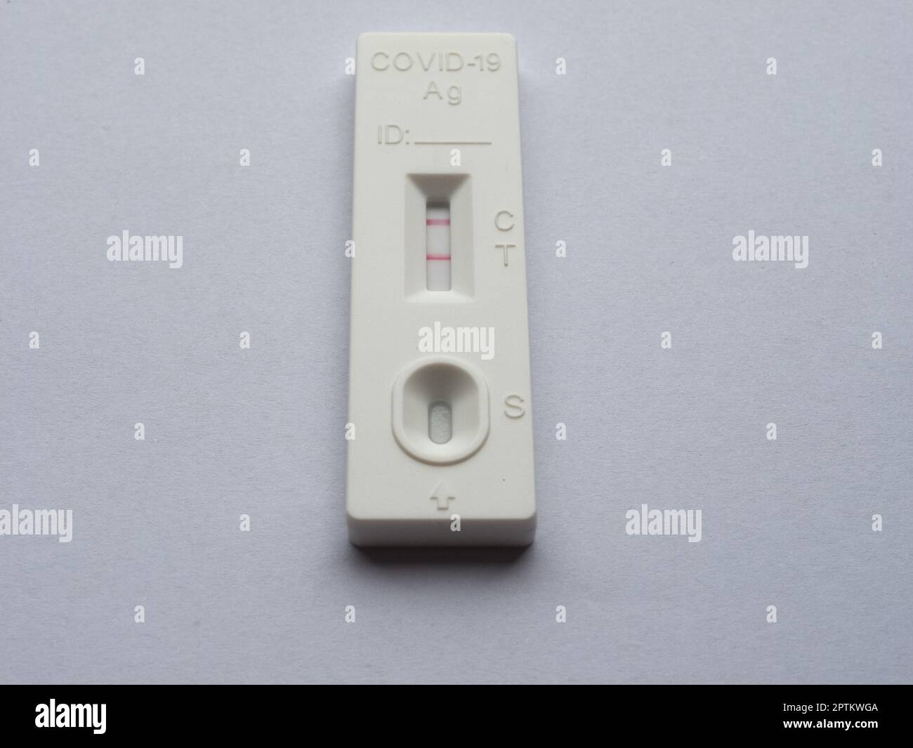 Positive Covid 19 antigen rapid test specimen well Stock Photo - Alamy