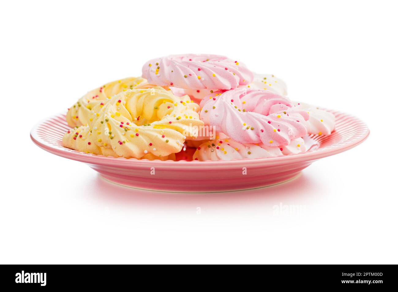 Different colors meringues with sprinkles isolated on the white ...