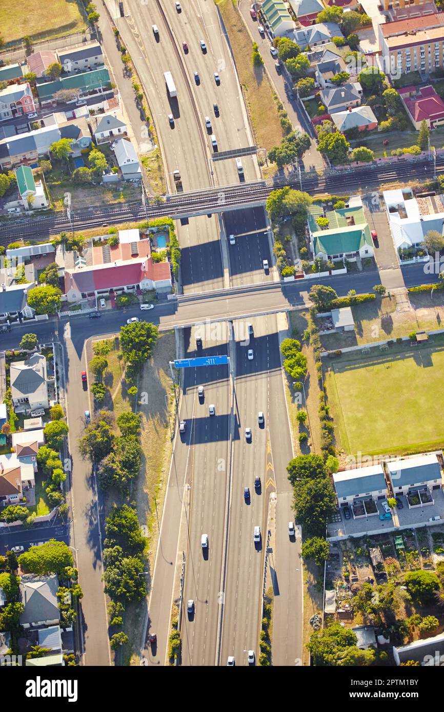 Cutting through the urban landscape. Aerial view of a busy highway ...
