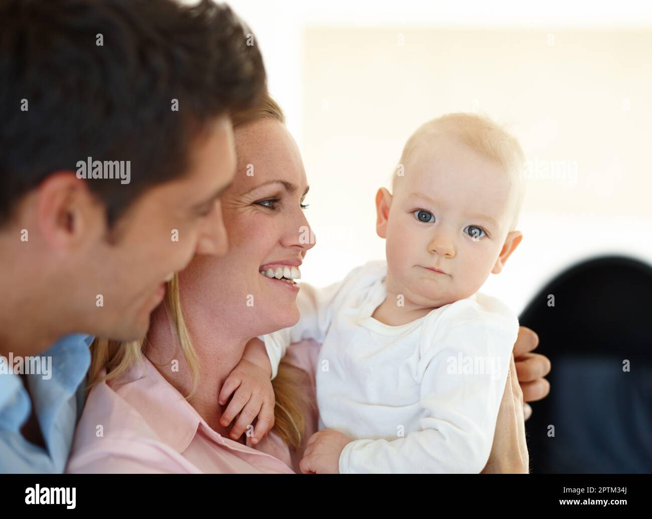 Family means being loved no matter what. a contented family smiling ...